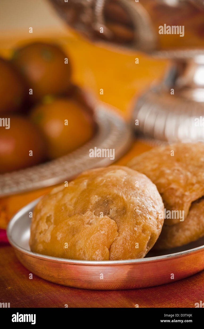 Close-up of two kachories (deep fried traditional Indian snack) in a ...