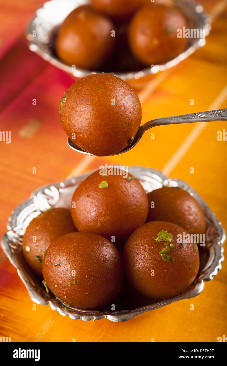 Close-up of two bowls of gulab jamuns (a popular traditional Indian ...