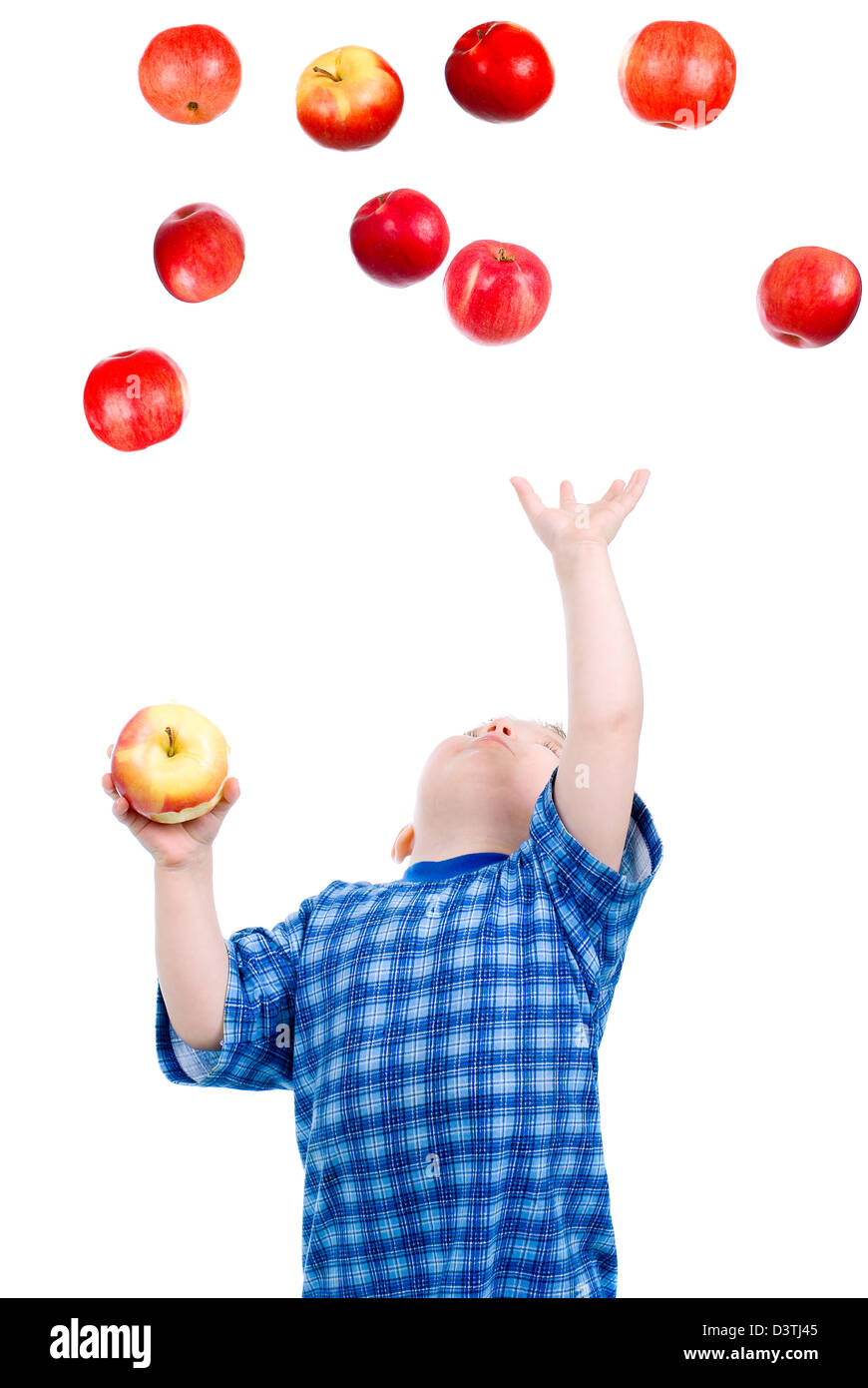 Little boy caughts flying apple .isolated on white background Stock ...