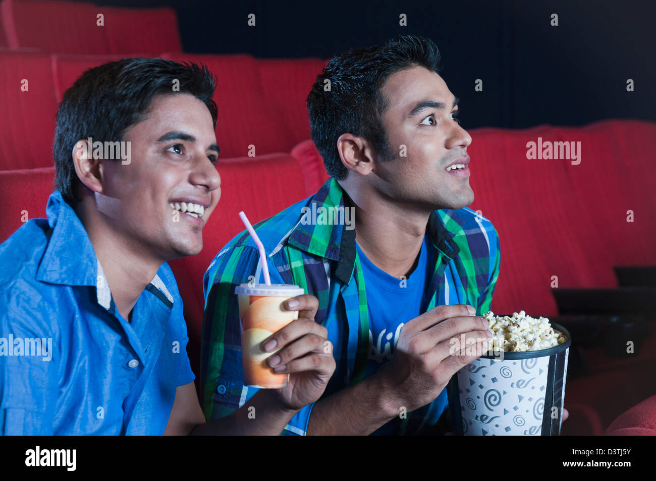 Indian friends enjoying movie hi-res stock photography and images - Alamy