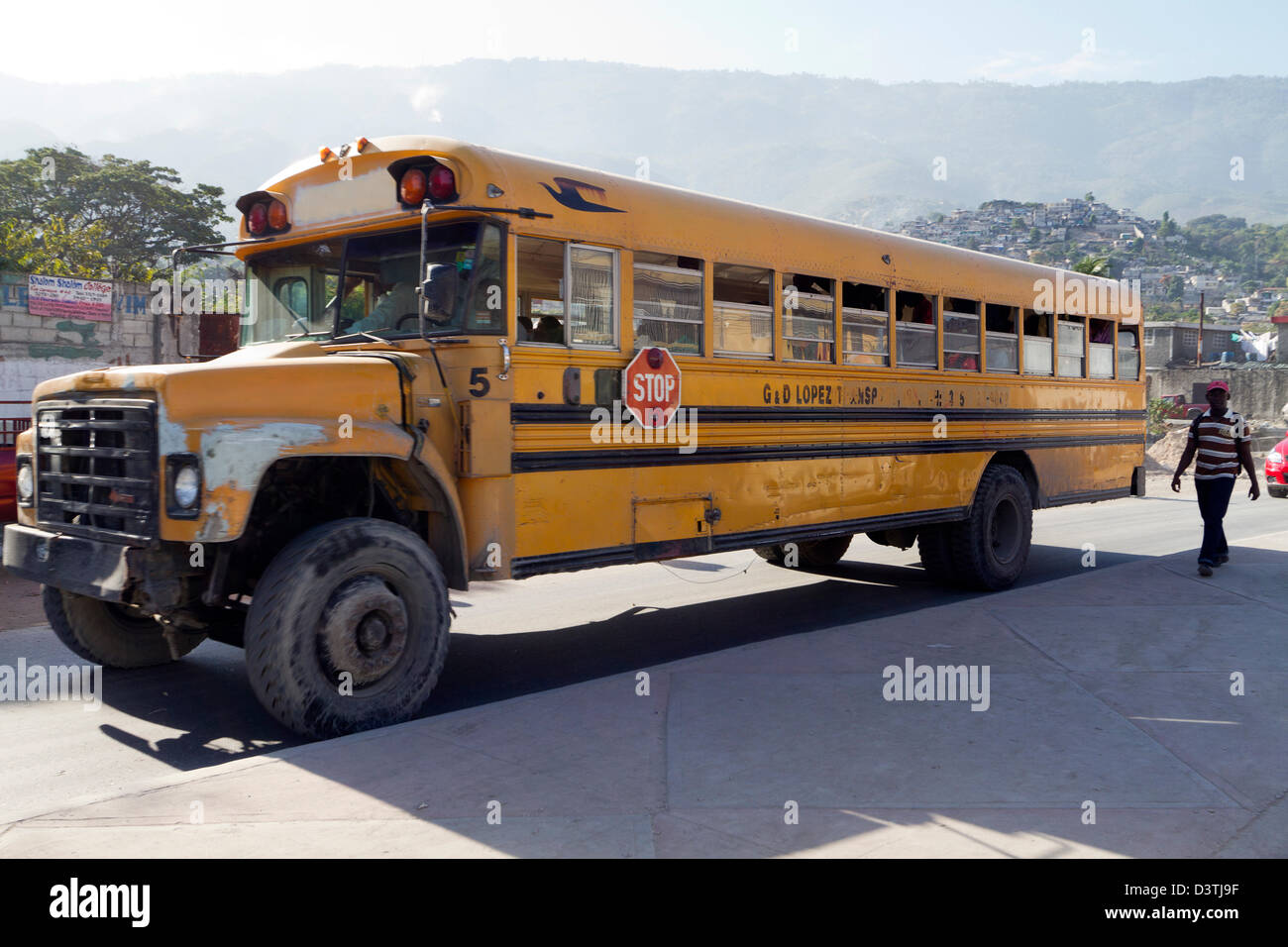 Tap-tap buses passing through the downtown of Port-au-Prince. Tap-tap ...