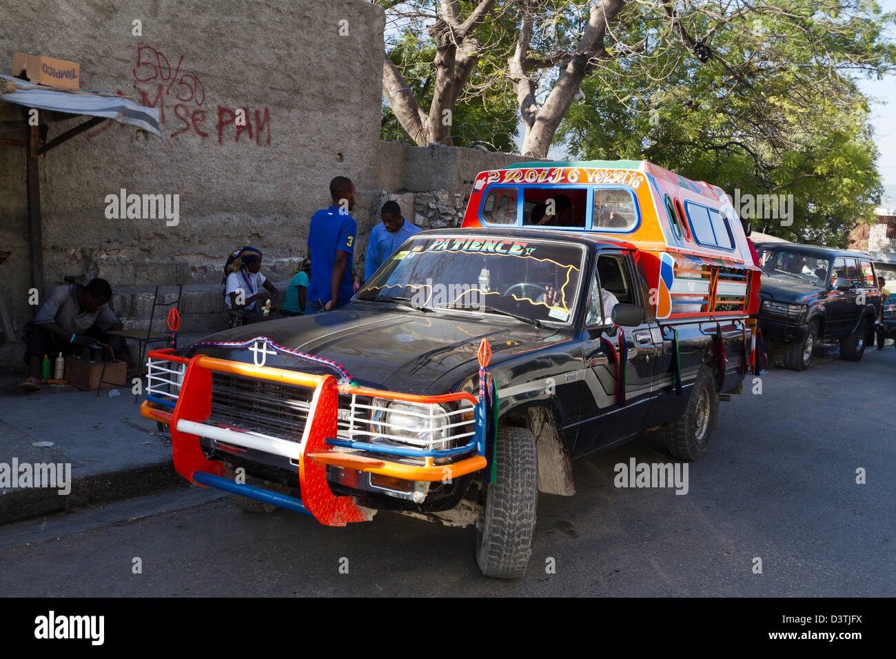 Tap-tap buses passing through the downtown of Port-au-Prince. Tap-tap ...