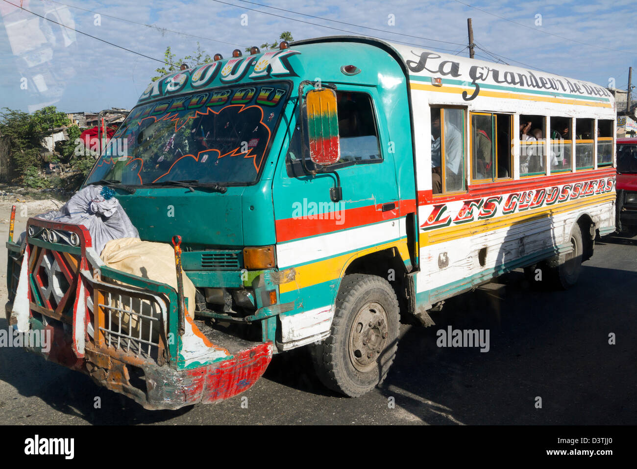 Tap-tap buses passing through the downtown of Port-au-Prince. Tap-tap ...