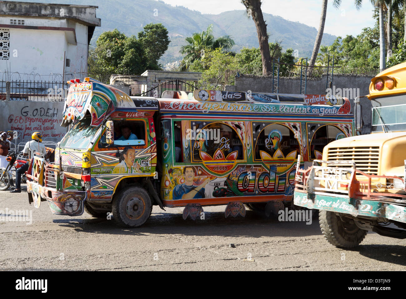Tap-tap buses passing through the downtown of Port-au-Prince. Tap-tap ...