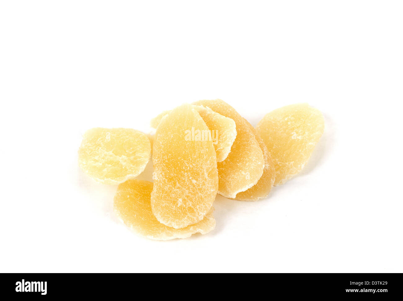 yellow dried mango slices on white background Stock Photo - Alamy