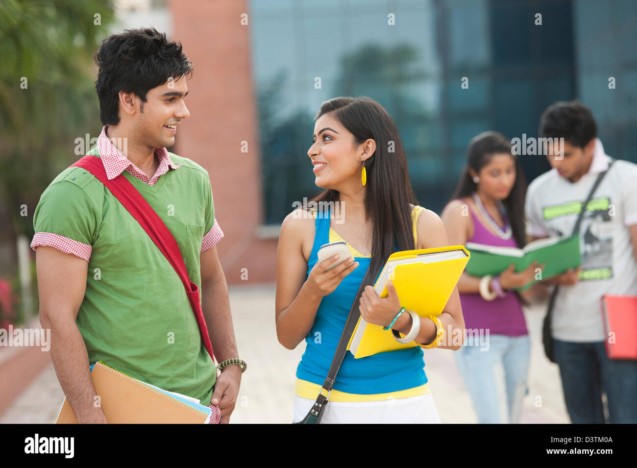 University students discussing in university campus Stock Photo - Alamy
