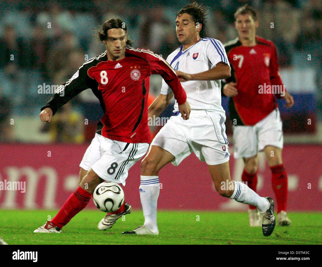 German national player Torsten Frings (L) and Slovak Martin Petras vie ...