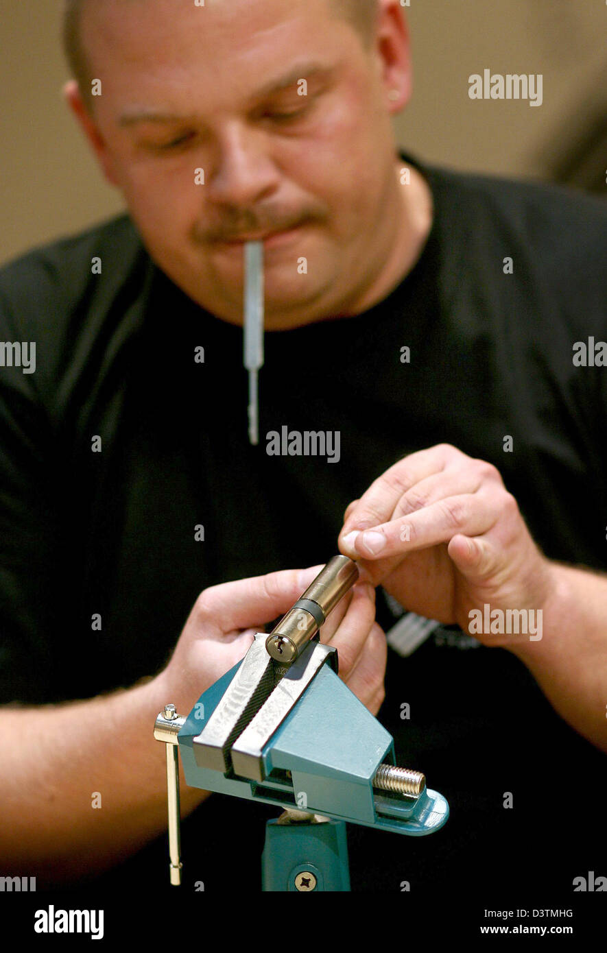 A participant of the German Championship in lock picking tries to open ...