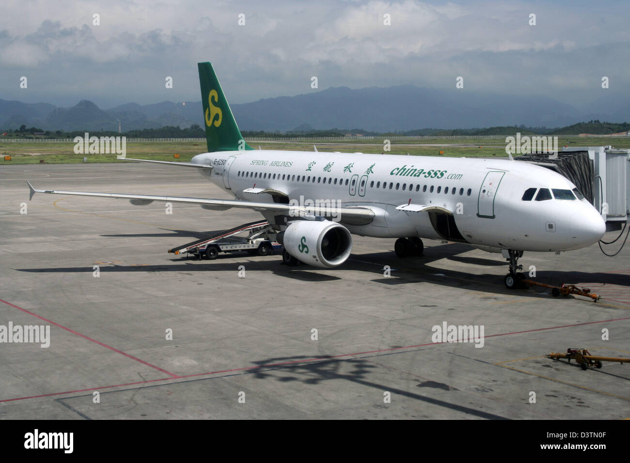 The picture shows an airplane of Spring Airlines at the airport of ...