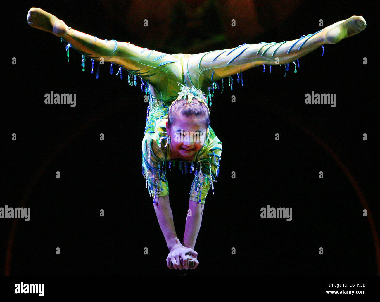 An artist makes an acrobatic performance during the dress rehearsal of ...