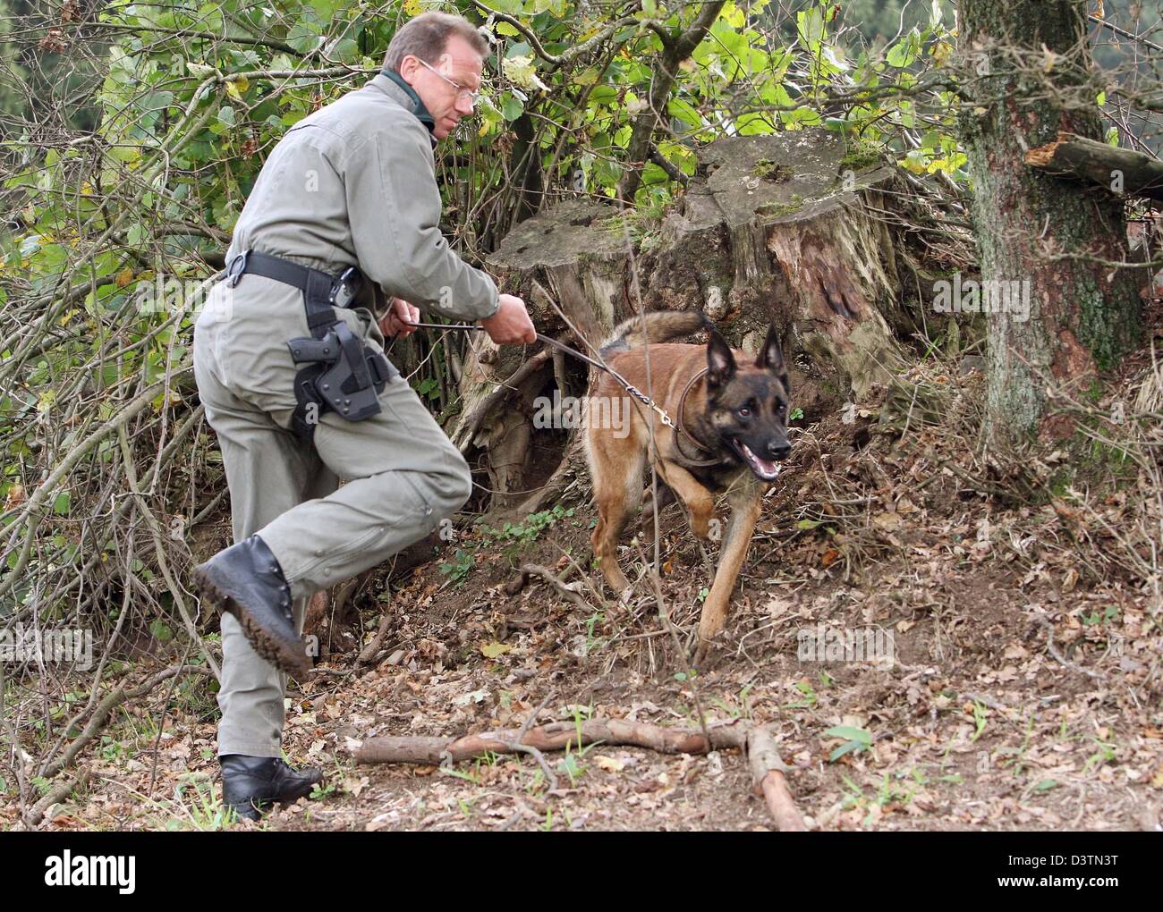 A police officer and a corpse-sniffing dog search for six-year-old ...