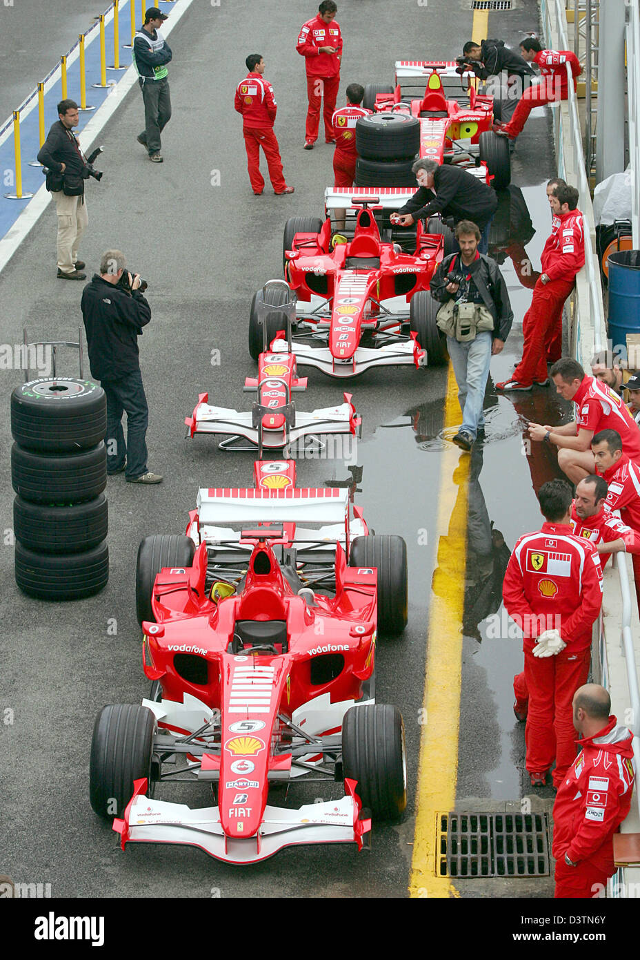 Ferrari racing cars line up in the pitlane at the Interlagos racetrack ...