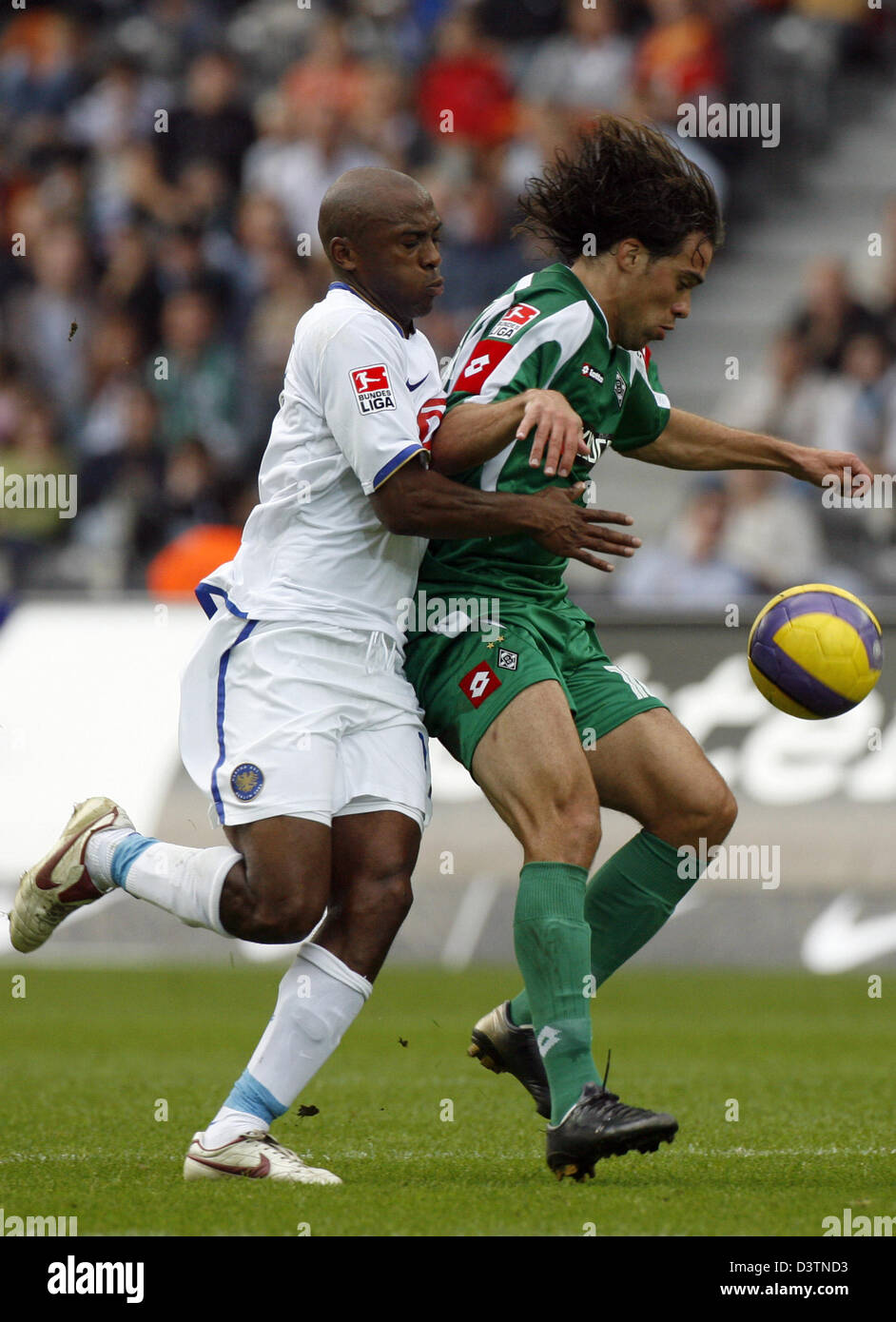 Ellery Cairo (L) of Berlin vies for the ball with Federico Insua of ...
