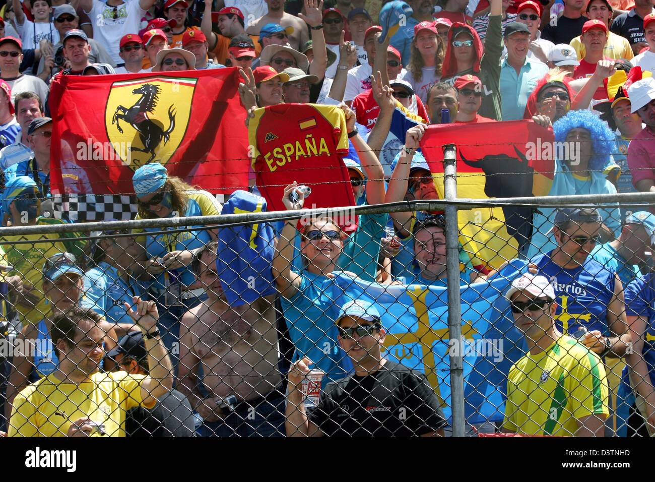F1 fans hold Renault and Ferrari flags before the F1 Grand Prix of ...