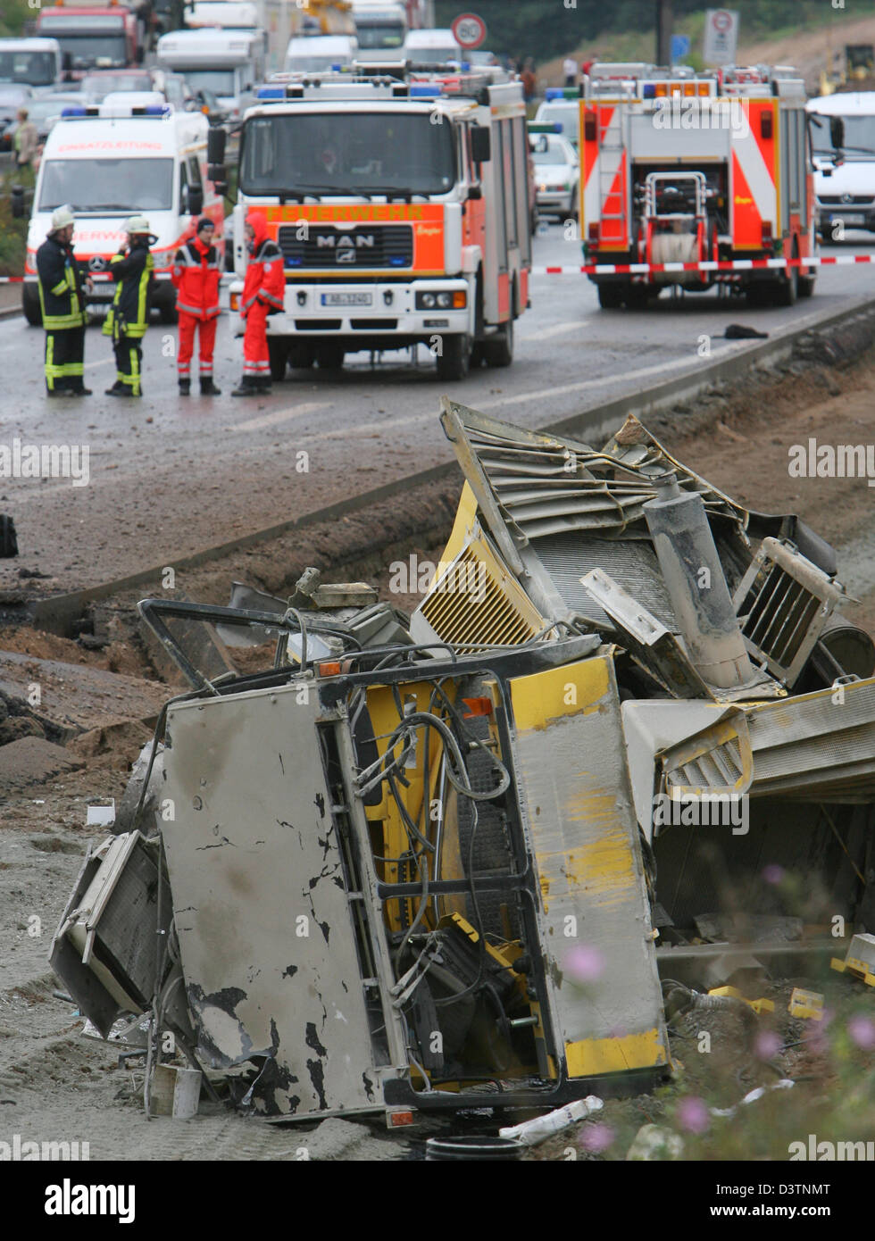 The photo shows a destroyed construction site vehicle on the motorway ...
