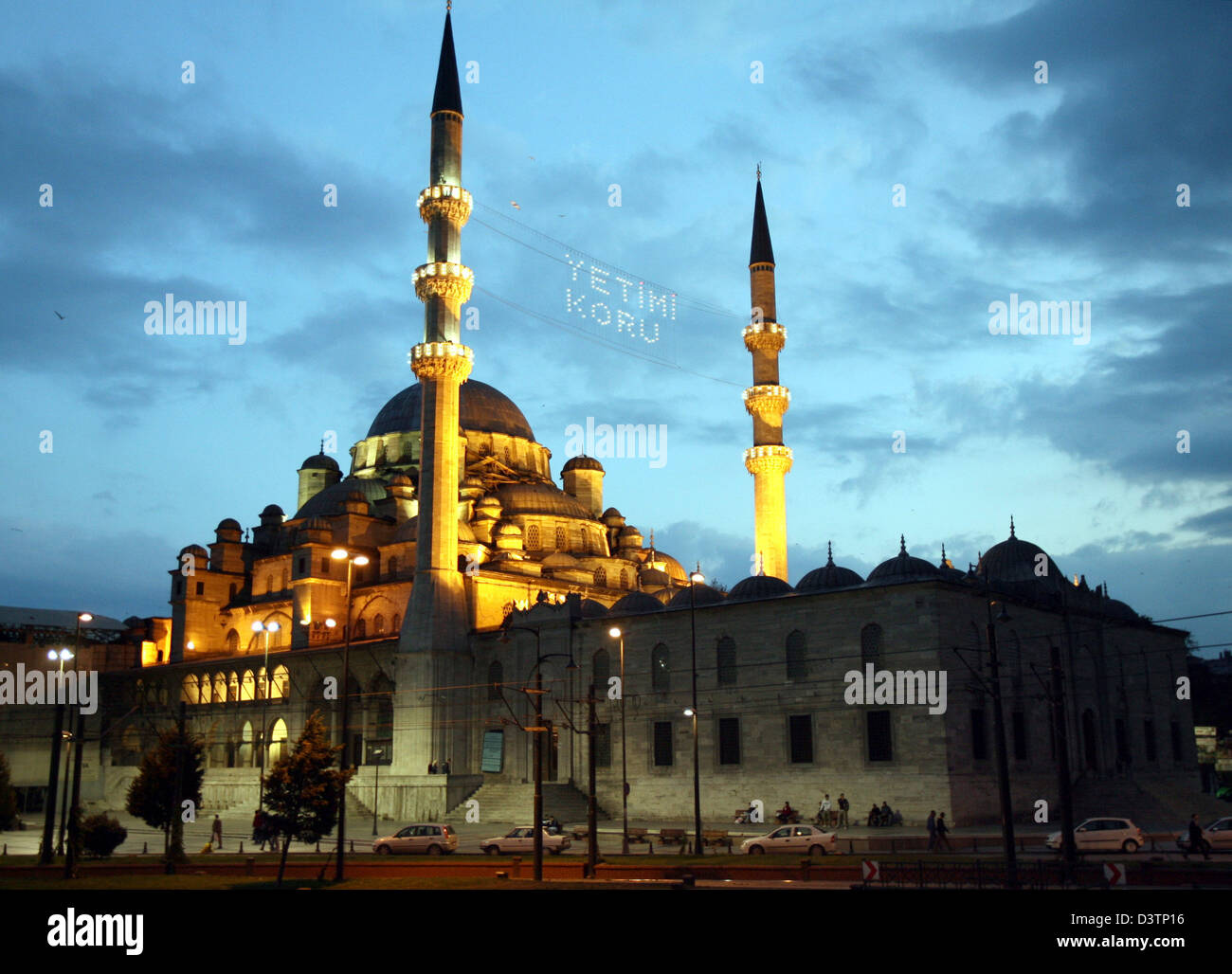 The photo shows the Yeni Mosque at night in Istanbul, Turkey, Monday ...