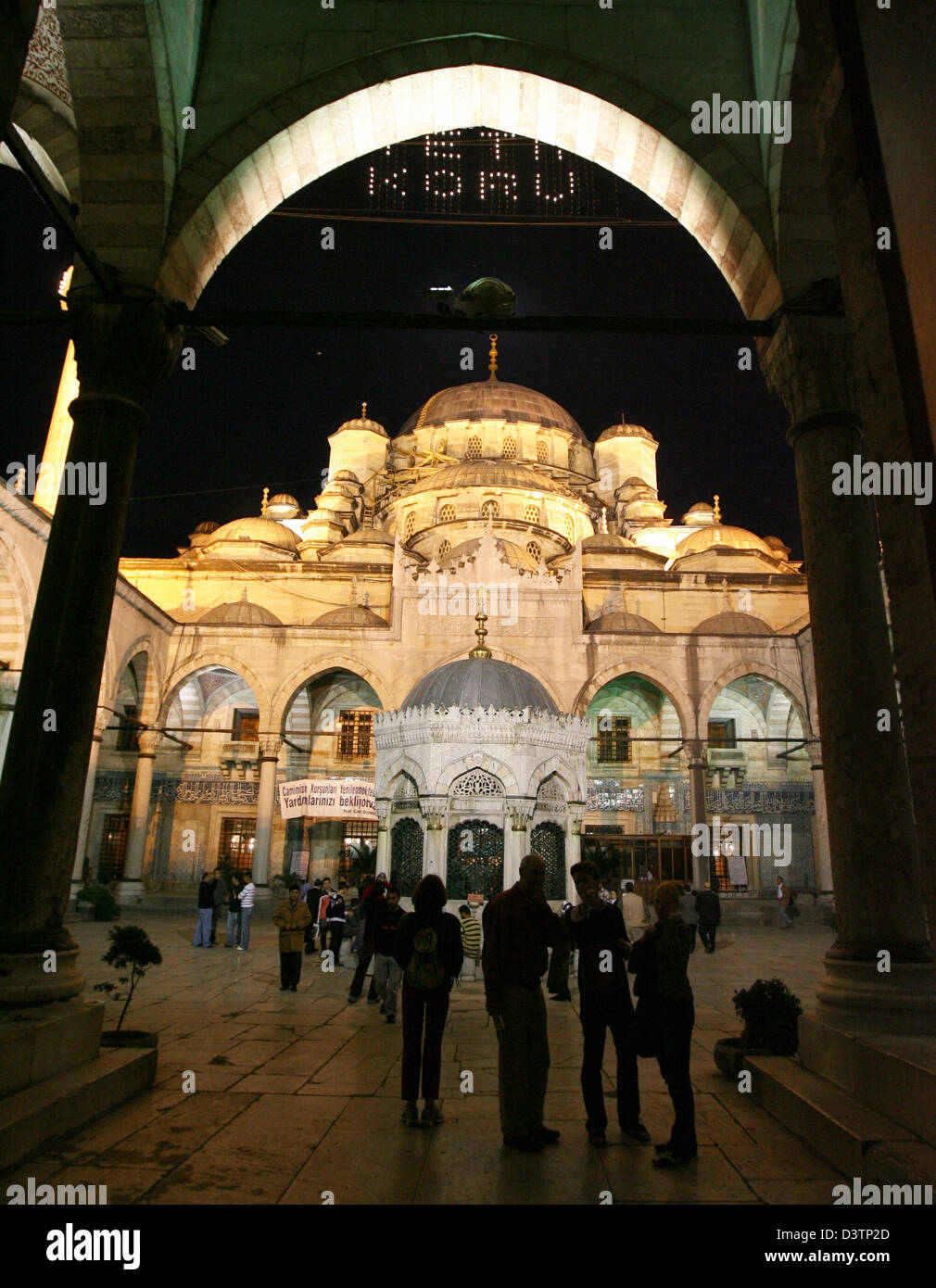 The photo shows the Yeni Mosque at night in Istanbul, Turkey, Monday ...