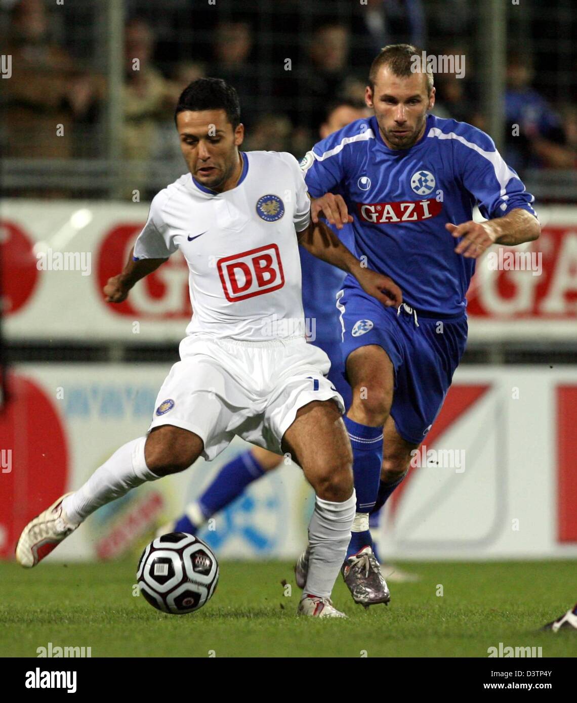Lazlo Kanyuk (R) of Stuttgart vies for the ball with Berlin's Yildiray ...