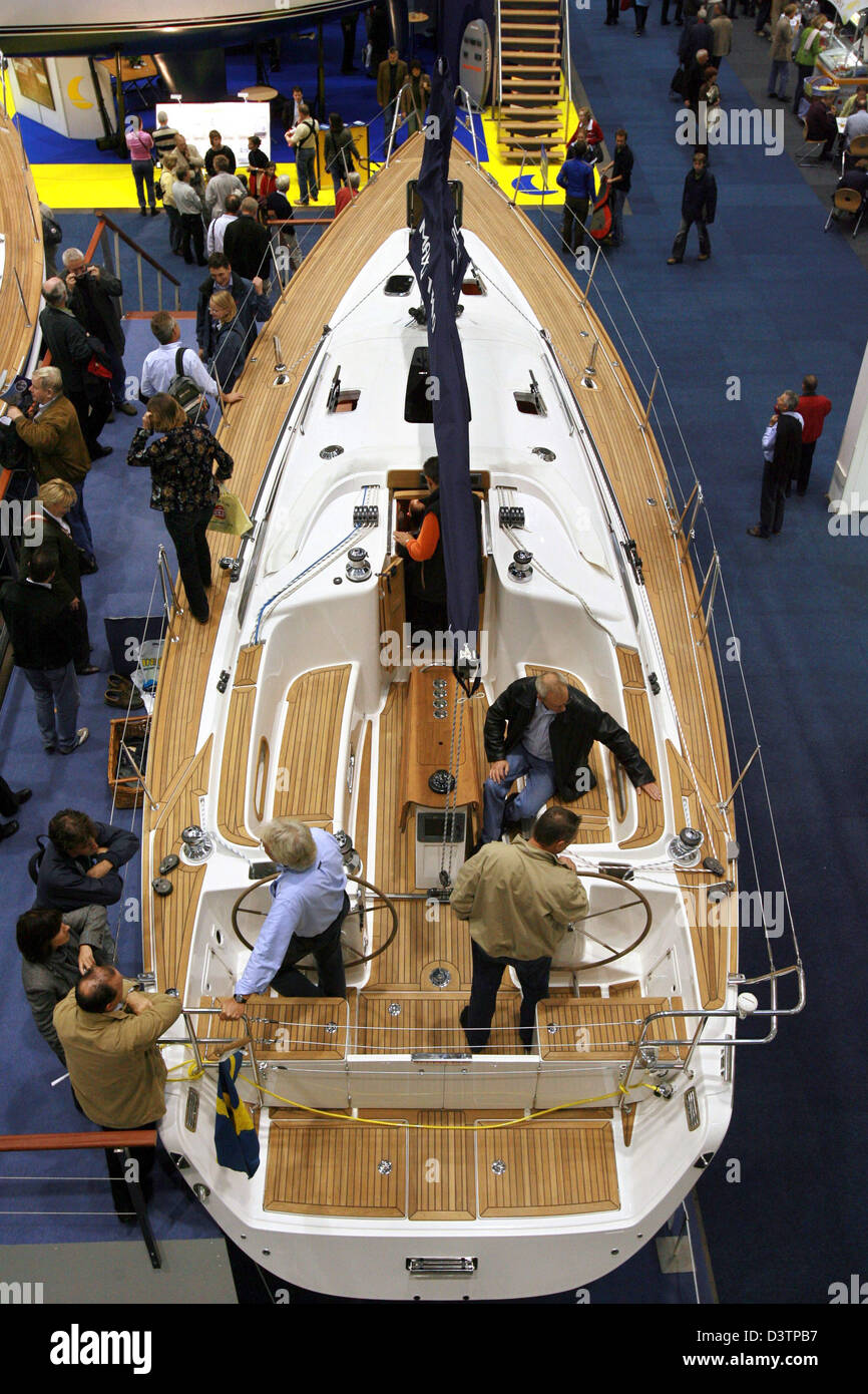 Visitors of the 47th international boat show 'Hanseboot' take a look at ...