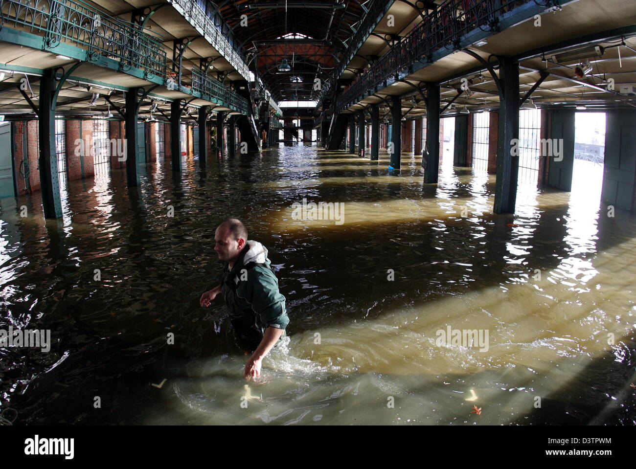 Helper Stefan Boegert tries to secure floating beer barrels in the ...