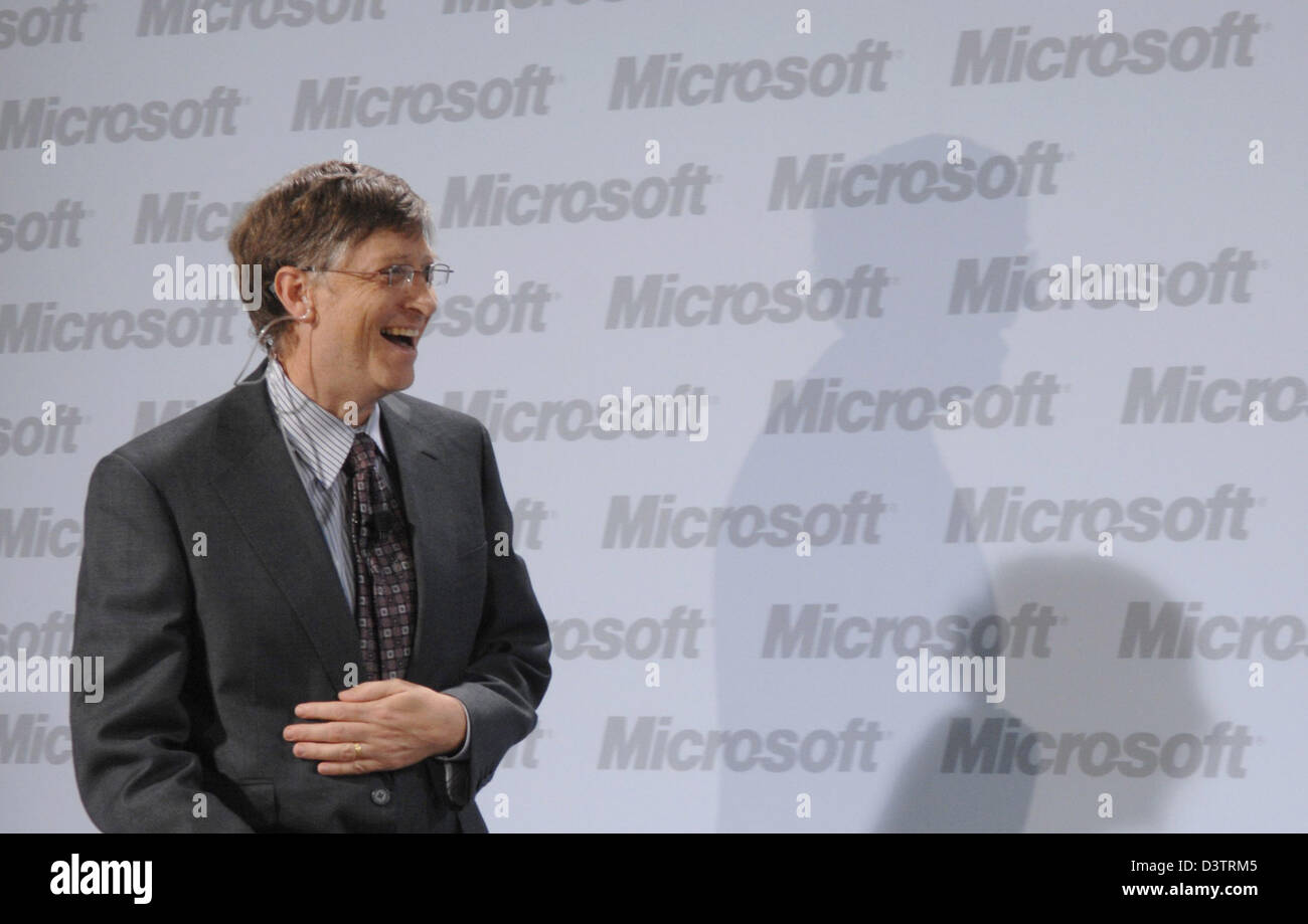 Microsoft founder Bill Gates stands in front of a wall with the ...
