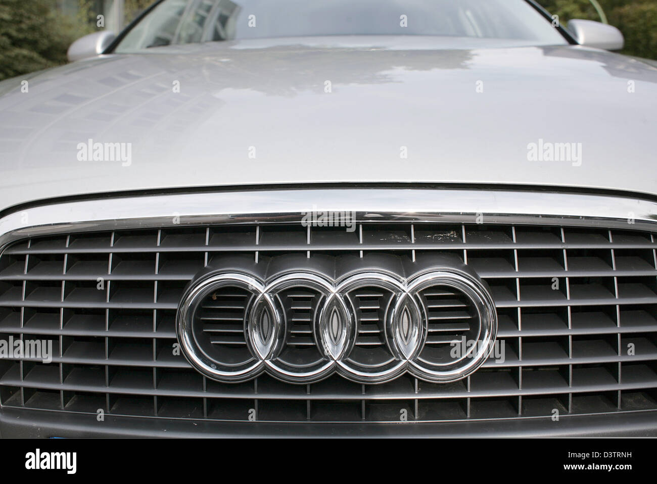 The photo shows the company logo of Audi, four engulfed rings, on a ...