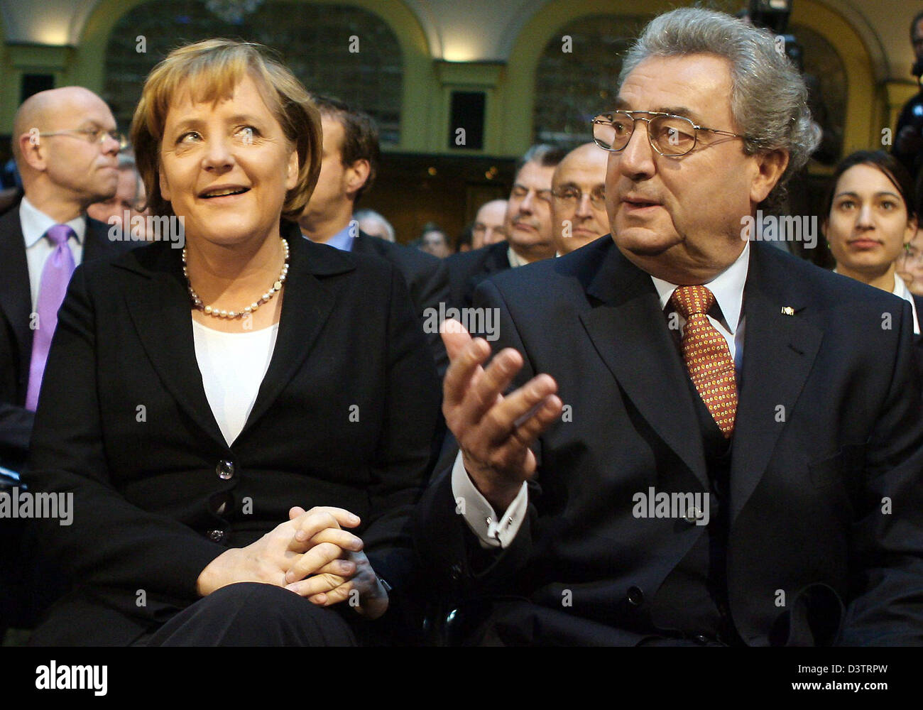 German Chancellor Angela Merkel (L) and Dieter Hundt (R), President of ...
