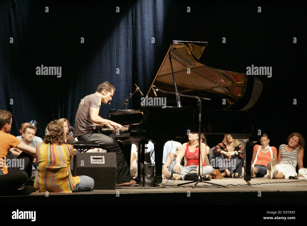 Joshua Kadison shown on stage at the Muffathalle' concert hall in ...