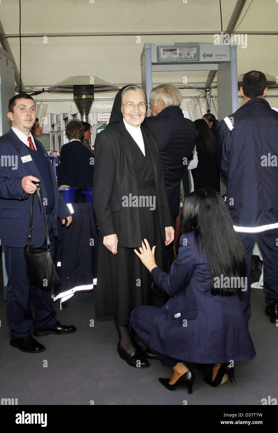 The picture shows a nun during a security check in front of the new ...