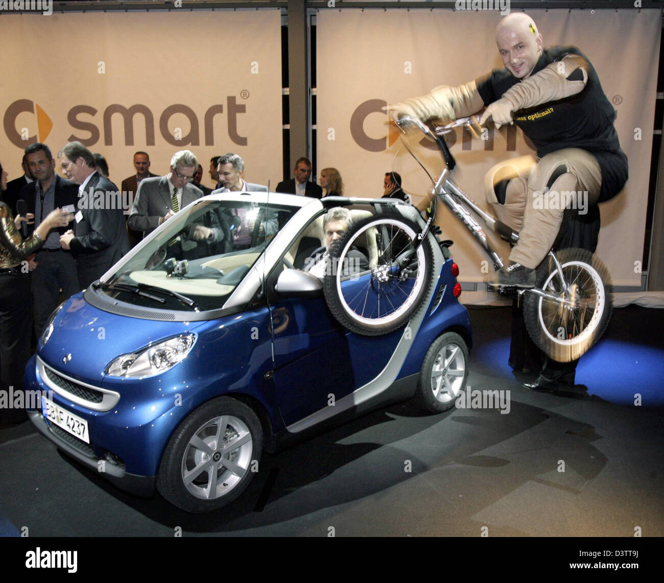 A cyclist jumps in the air during the world premiere of the new 'smart ...
