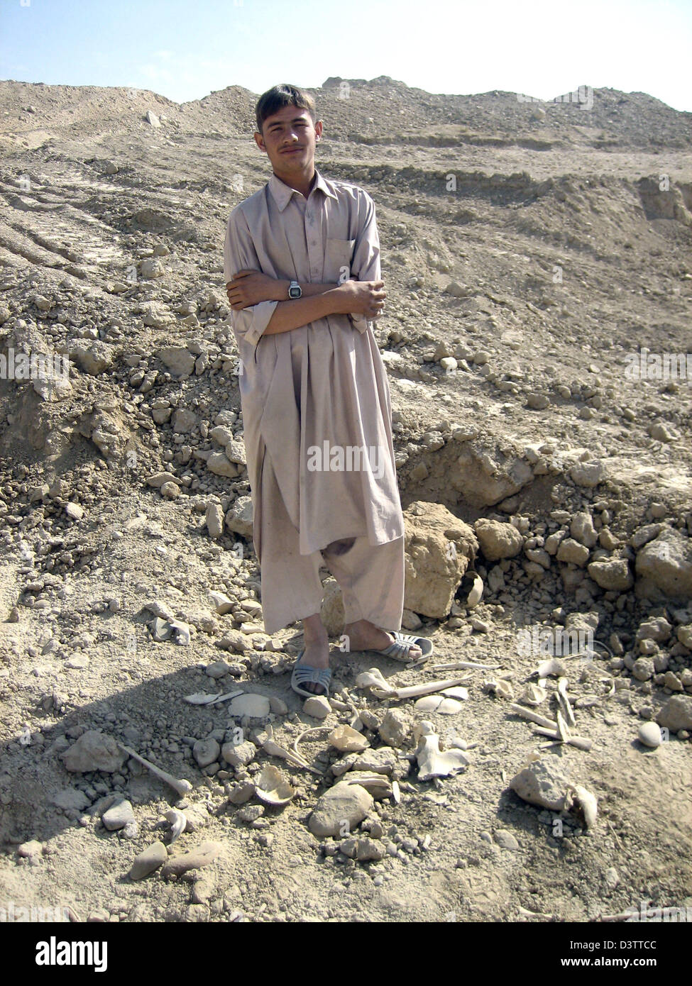 Mohammad Shoaib pictured with remains at the bone field near Kabul ...