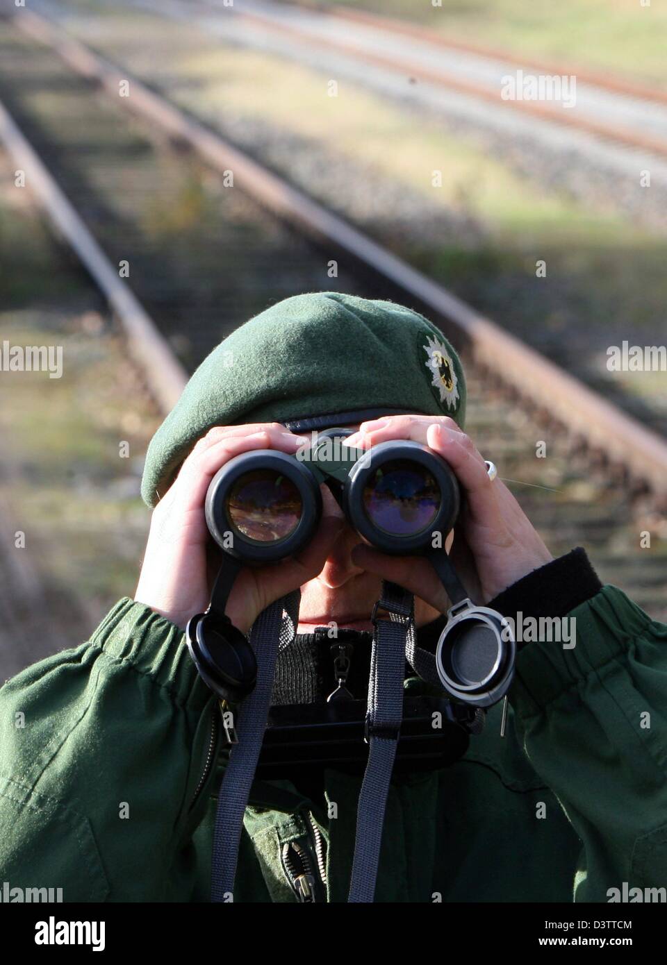 A Federal police officer checks the track for the CASTOR transport in ...