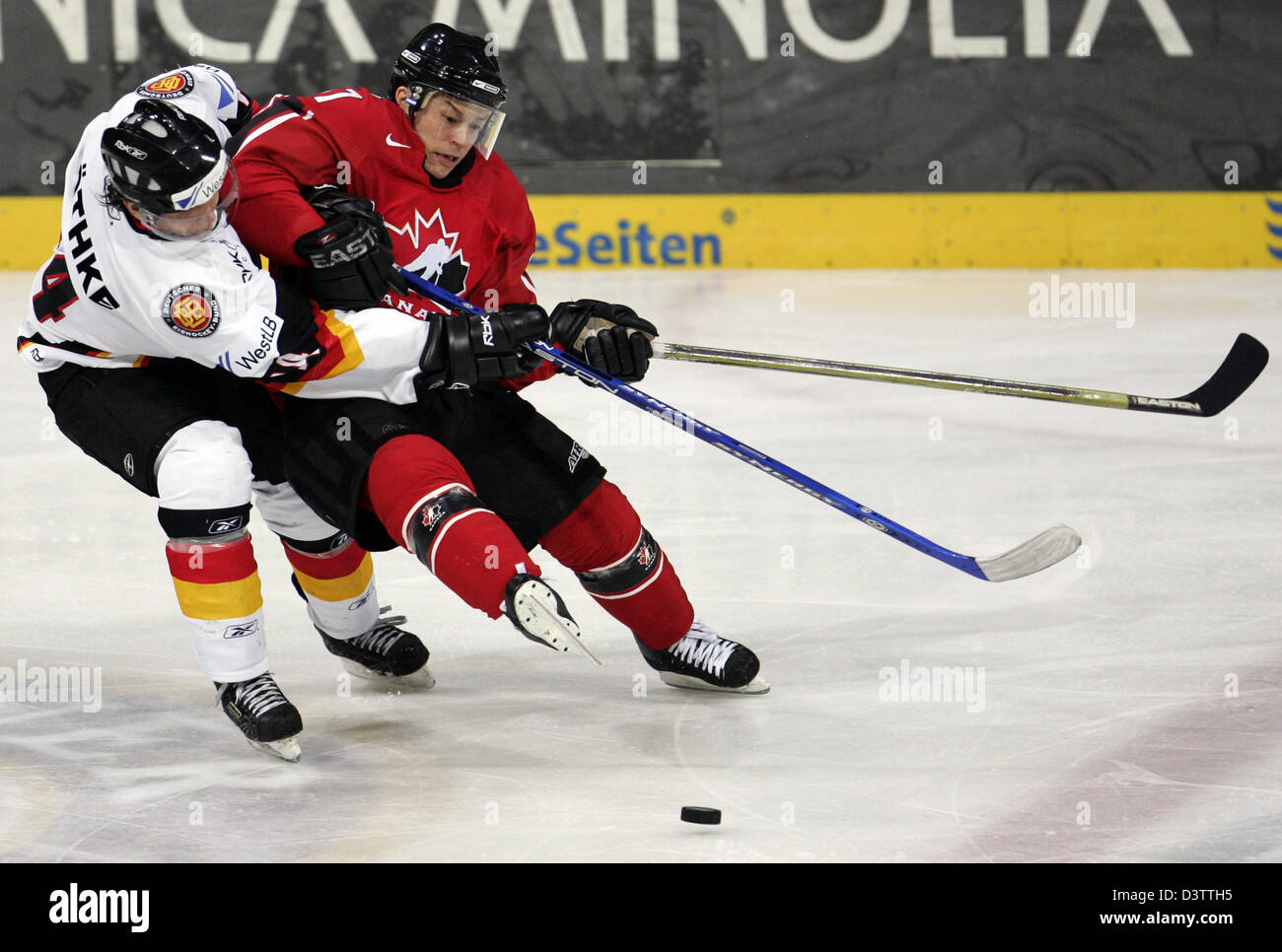 German player Rene Roethke and Canadian player Steve Kariya shown in ...