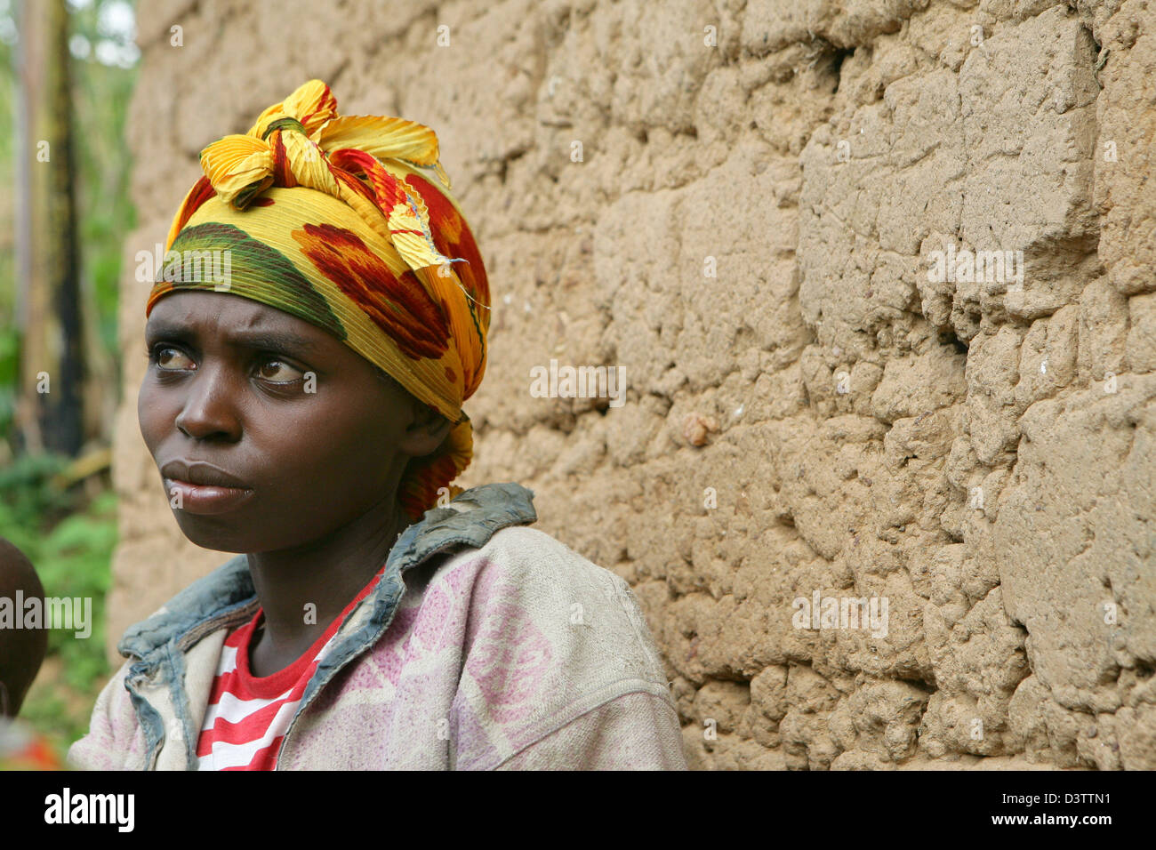 A young Rwandan woman wearing a traditional headscarf near Kigali ...
