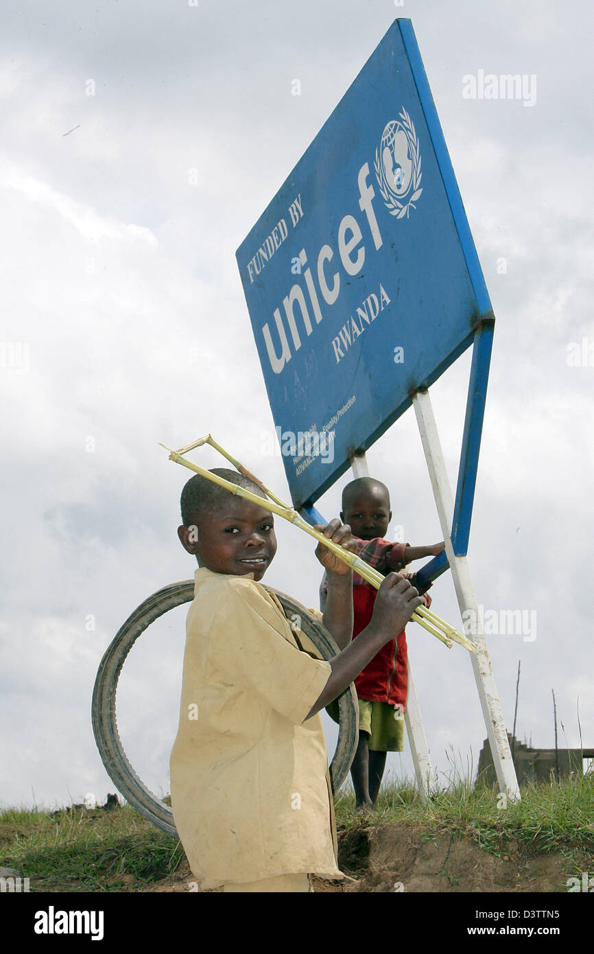 Two Rwandan boys pictured next to shield of UNICEF near Gisenyi, Rwanda ...