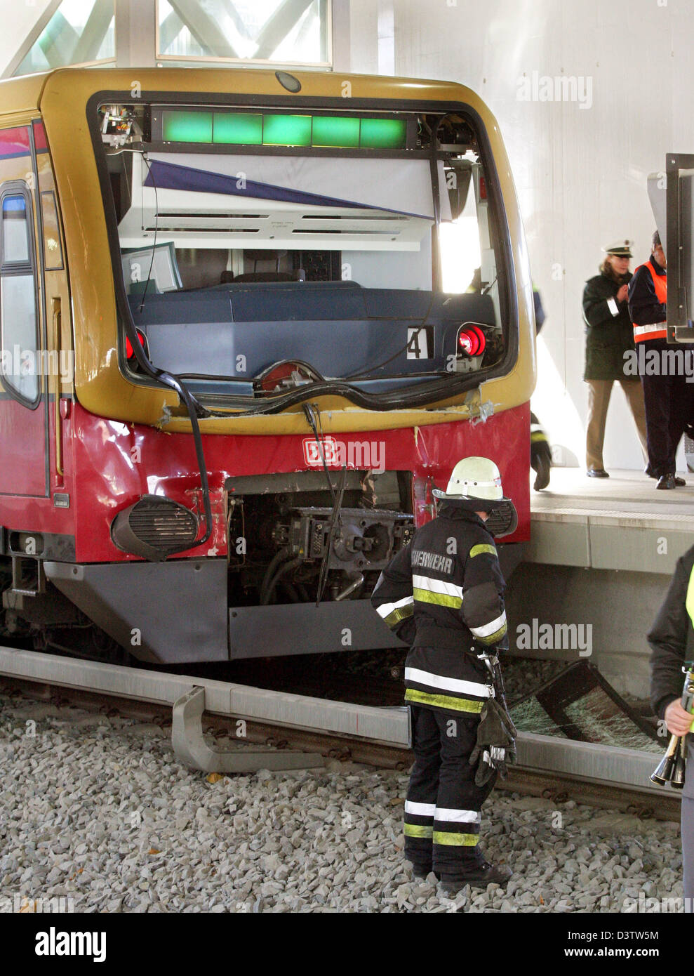 Emergency forces examine the damaged railcar at the Berlin station ...