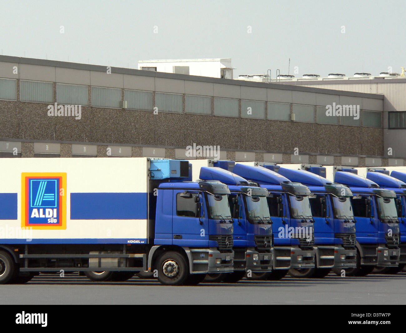 The picture shows trucks arranged in sequence at the centre of ...