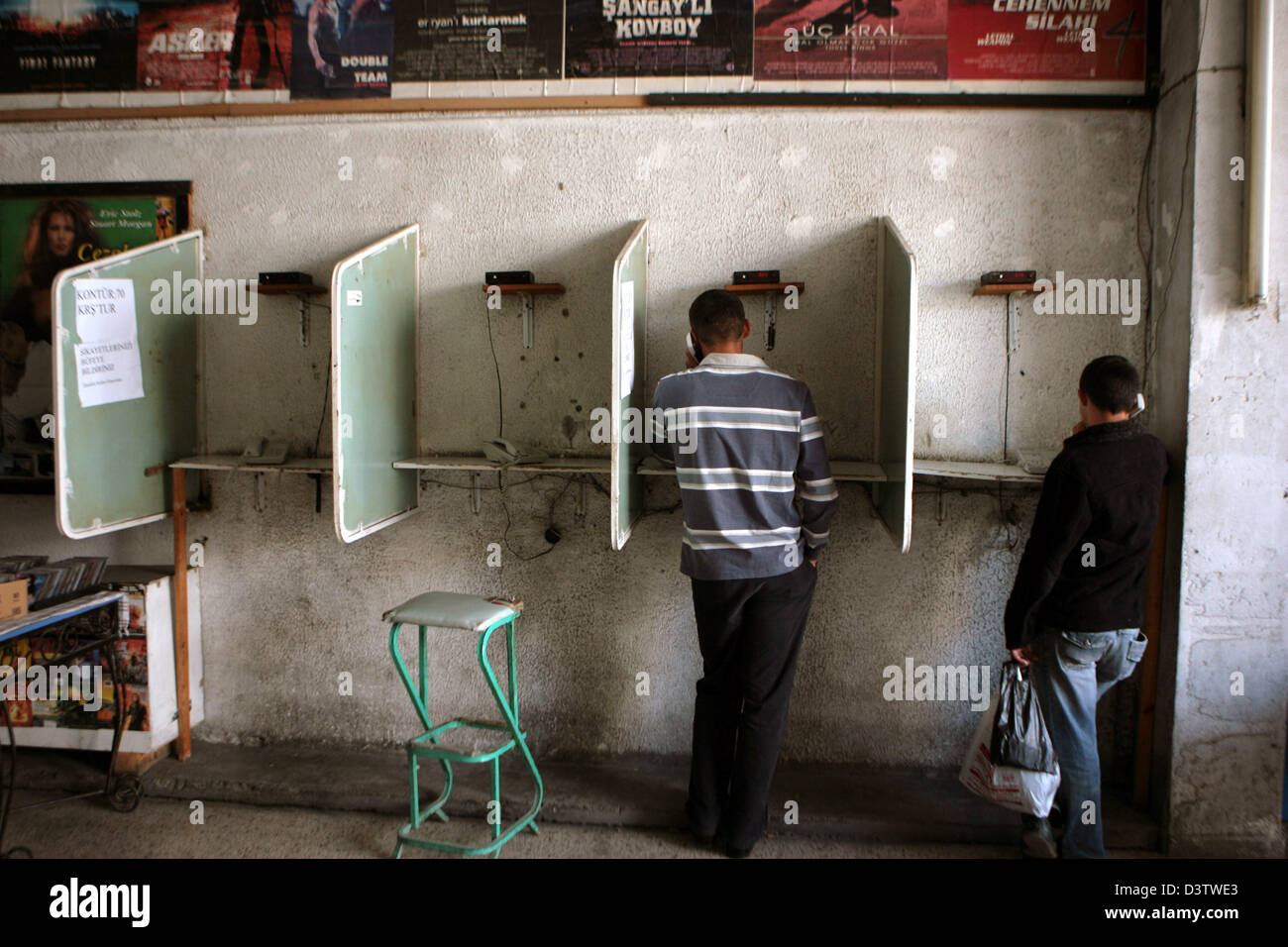 Two men make a call in a phone booth of the Turkish part of Nicosia ...