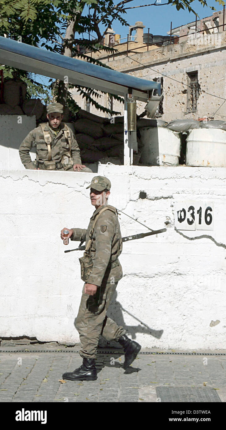 Greek border guards keep watch between the Greek and the Turkish part ...