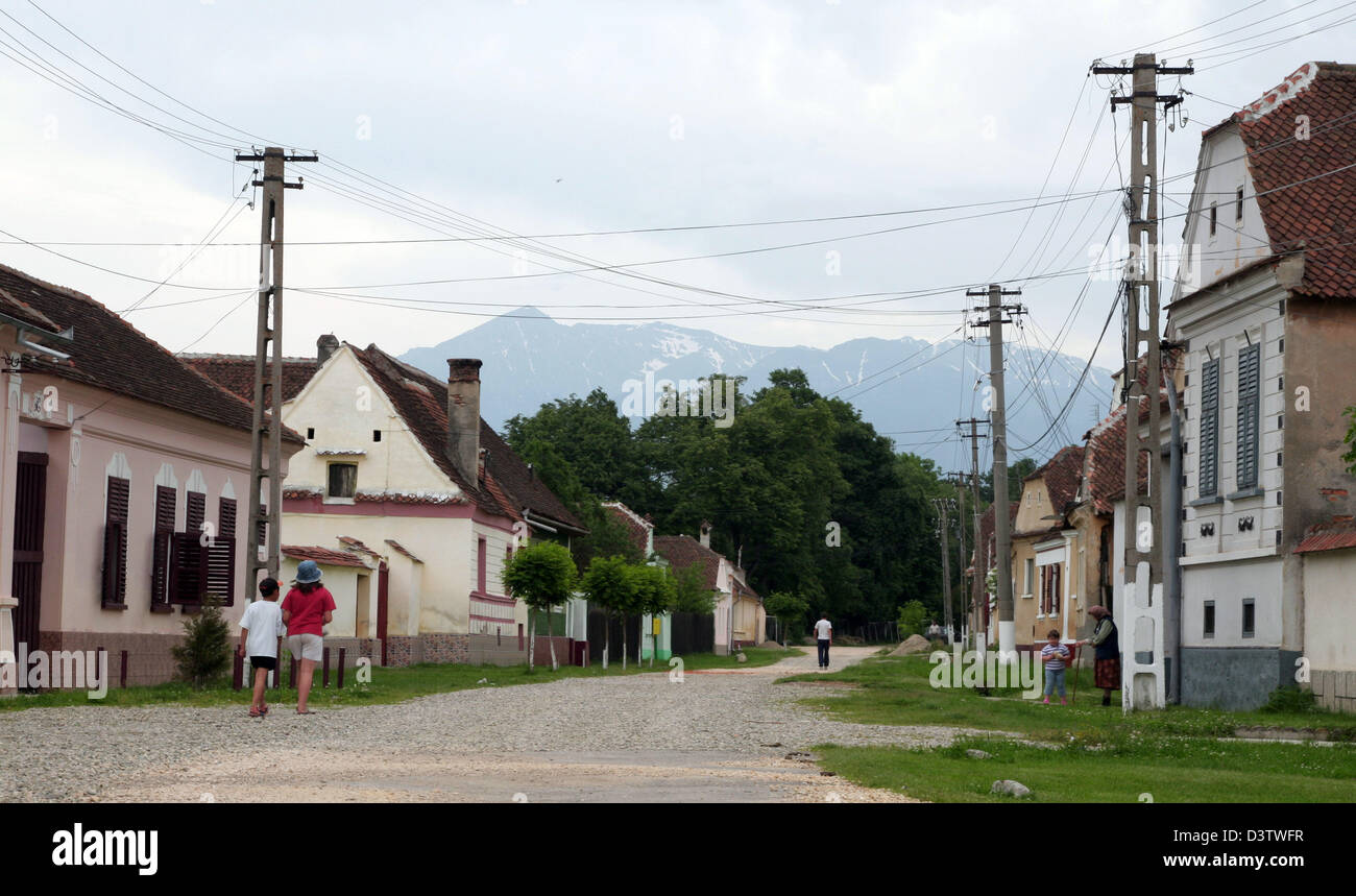 The photo depicts a street scene on the village gravel street in Vulcan ...