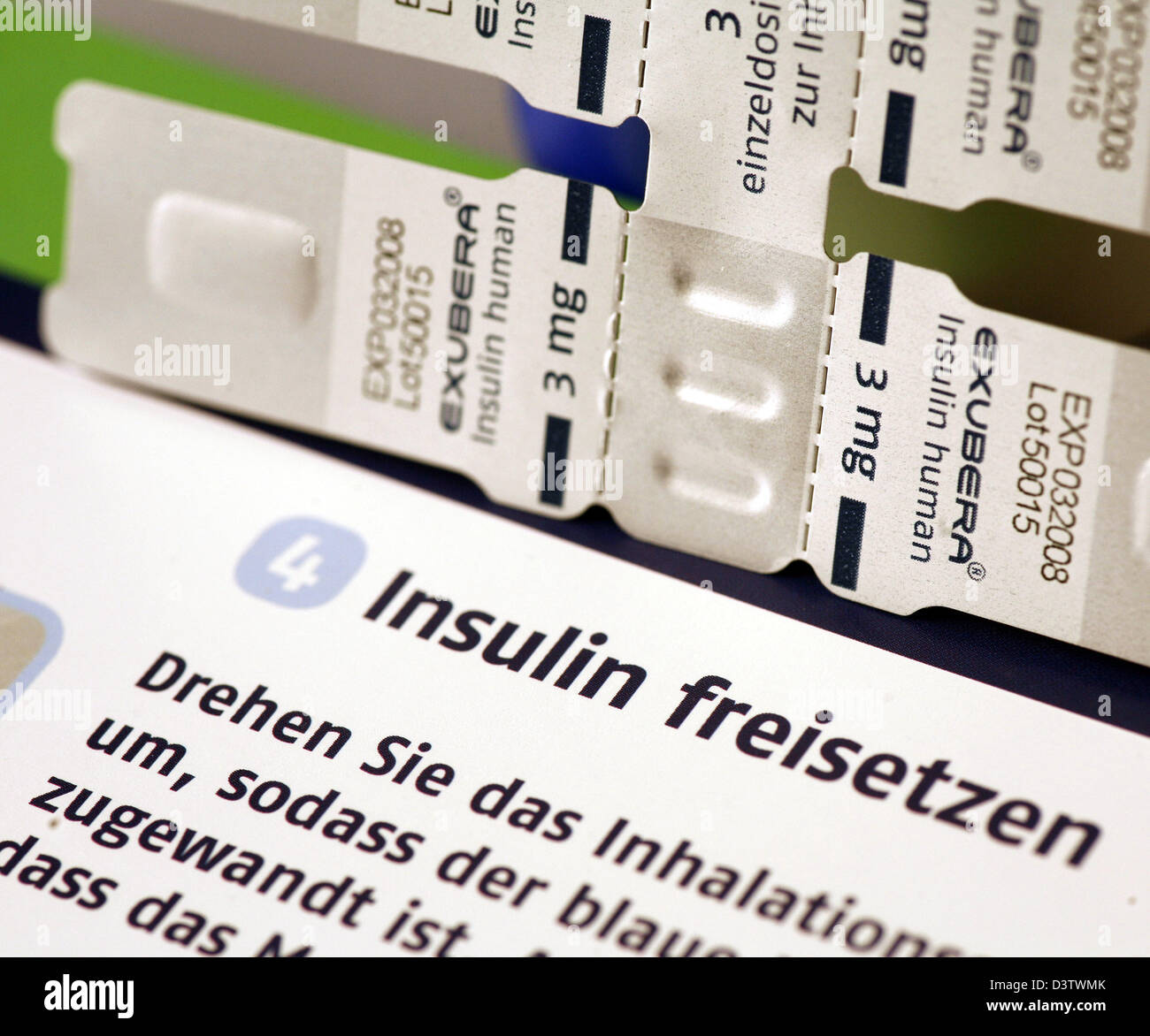 Insulin in blister packs shown next to an instruction manual for an ...