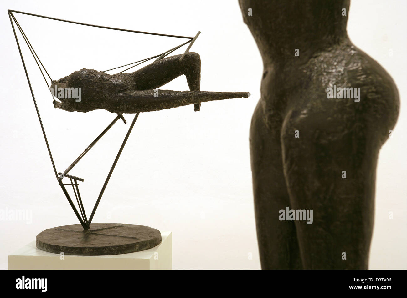 The sculptures 'Figure in Space' (1956, L) and 'Girl'(1954-56) by the ...