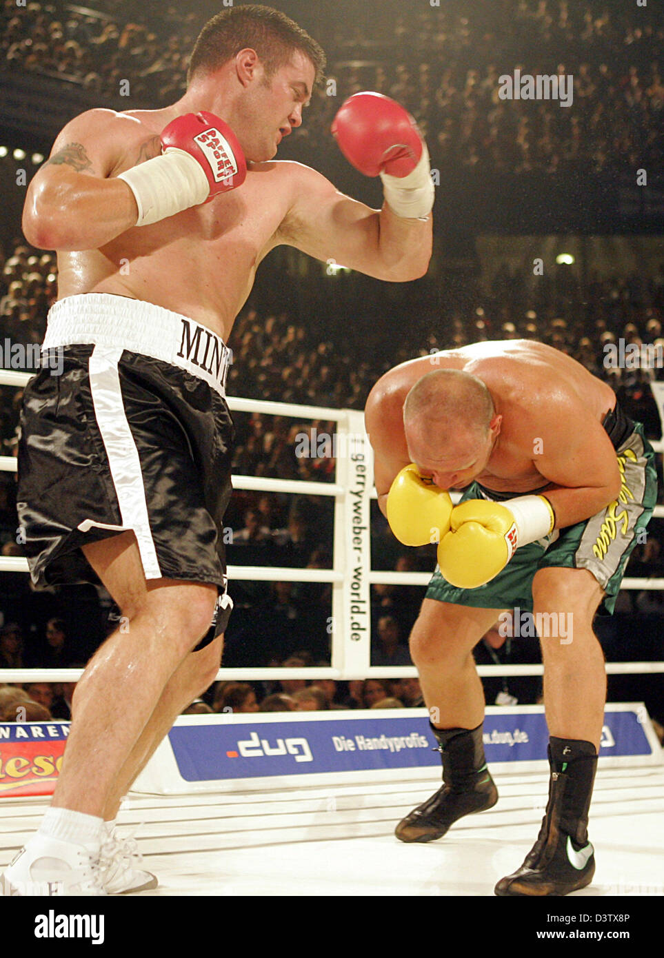 German boxer Axel Schulz (R) ducks from the whams of US pro boxer Brian ...