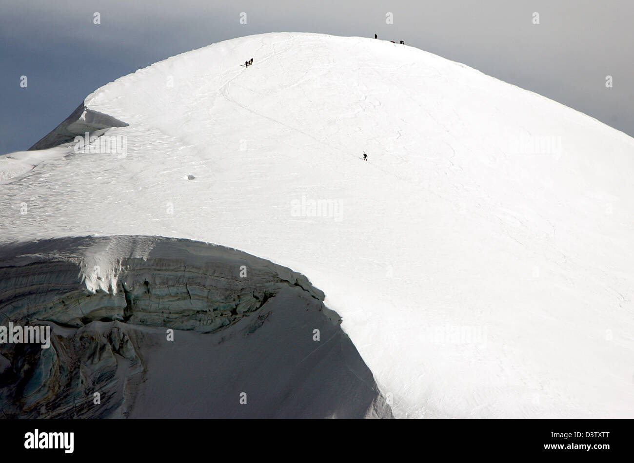 Ski hikers climb from the Little Matterhorn (3,883 metres) to the ...
