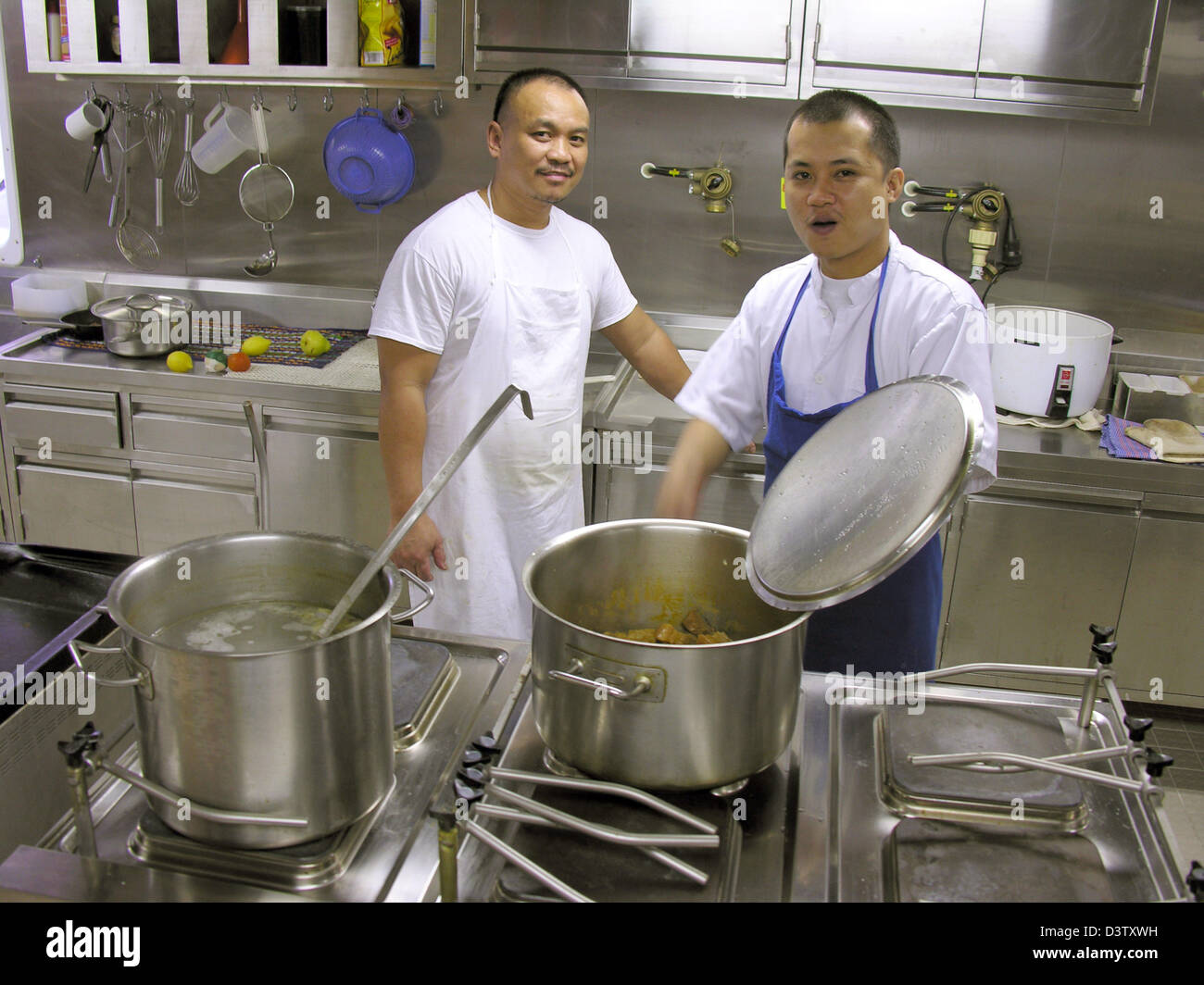 Two Philippine cooks pose in the caboose of the container ship LT ...