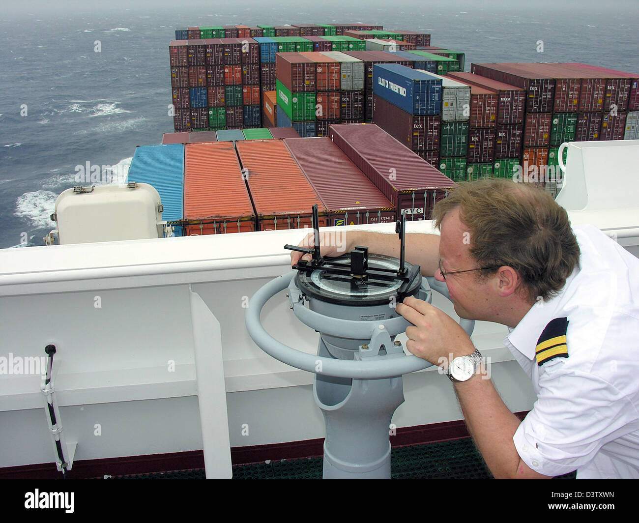 The photo shows the captain conducting nautical measurements on the ...
