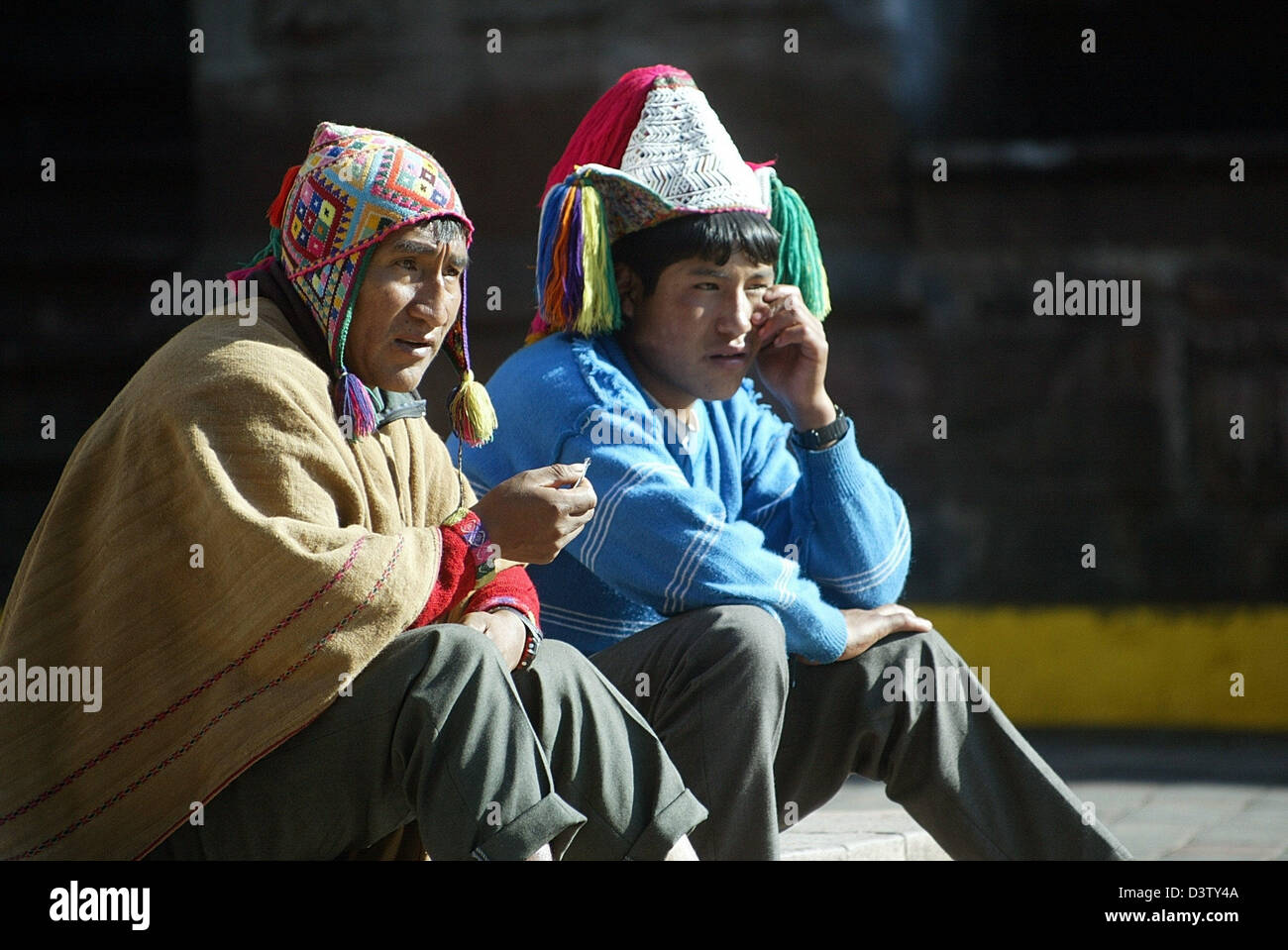 (dpa file) - Two Peruvian men in typical Peruvian clothes chat at the ...