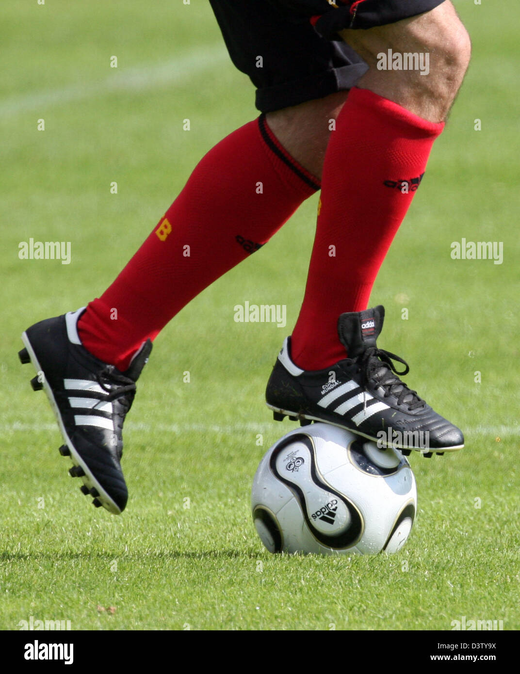 Legs jump over a ball at the training of the German national team in ...