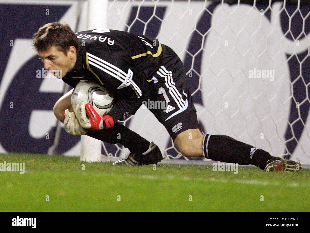 Leverkusen goalie Joerg Butt makes a save during the Bundesliga match ...