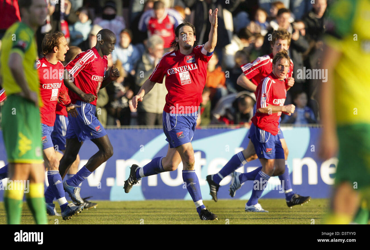 Stefan Buck (C) celebrates his second goal to the 3-0 score with his ...